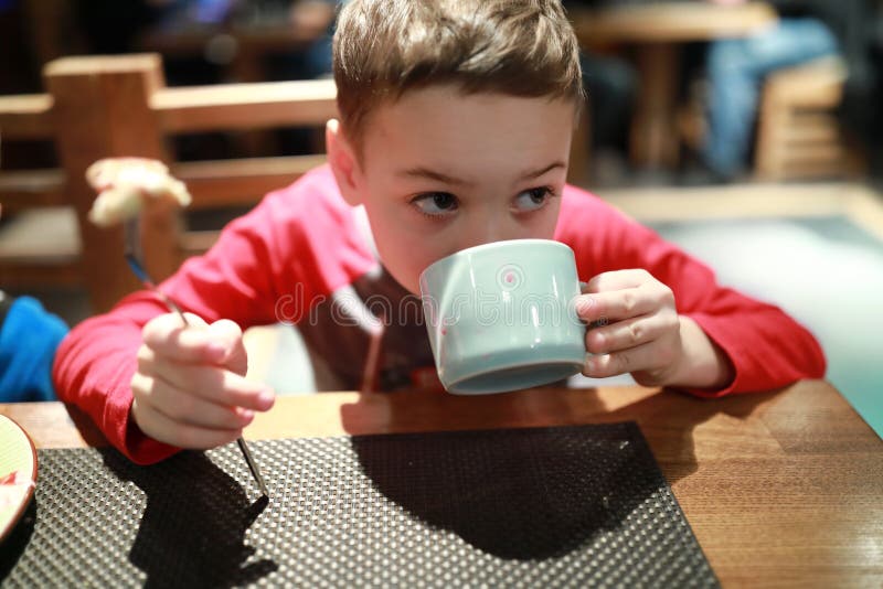 Child drinking tea stock image. Image of care, leisure - 136900015