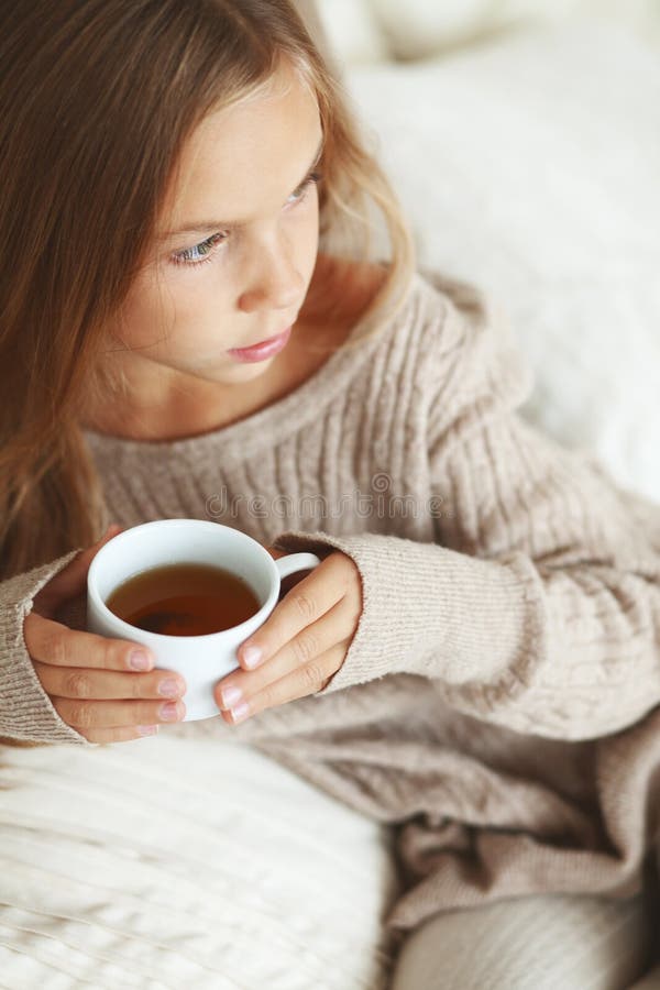 Child drinking tea stock image. Image of drinking, knitted - 34029657