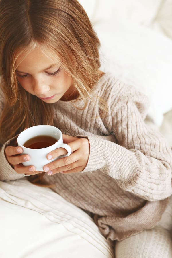 Child drinking tea stock image. Image of drinking, knitted - 34029657