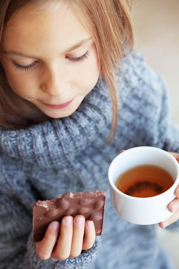 Child drinking tea stock image. Image of food, knitted - 34029705