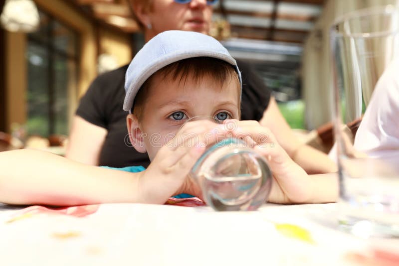 Child drinking water stock image. Image of cute, heat - 156909907