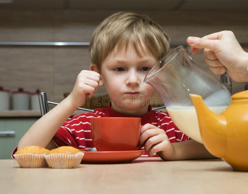 Child drinks tea with milk stock photo. Image of breakfast - 6782402