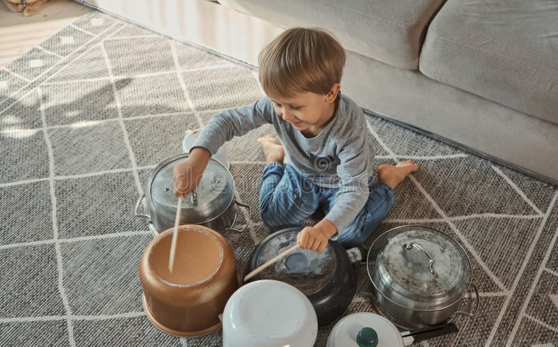 Child Drummer Having Fun Drum Playing on Kitchen Pans at Home Stock ...