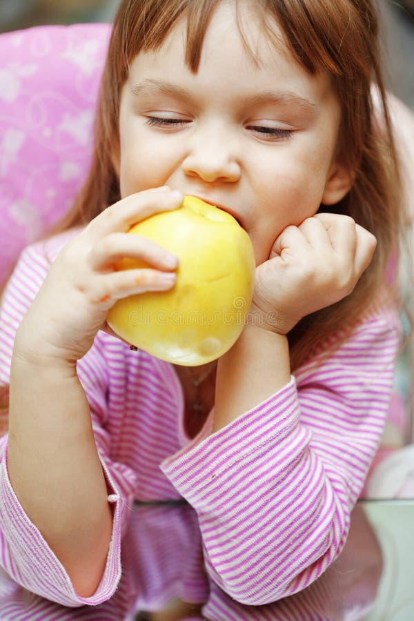 Child eating an apple stock image. Image of close, expression - 13423865