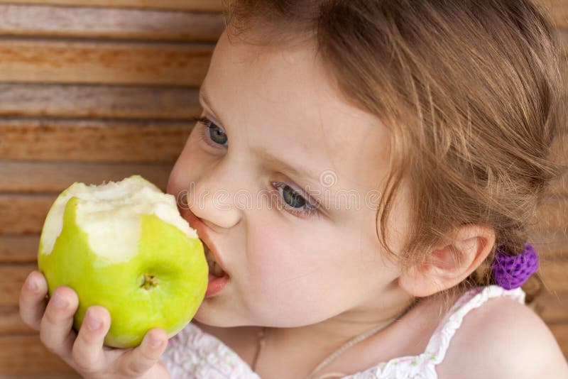 Child Eating An Apple Royalty Free Stock Image - Image: 24595646