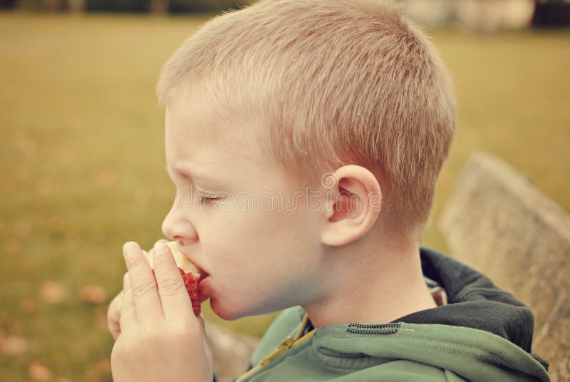 Child eating apple stock photo. Image of fruit, outdoor - 46991892
