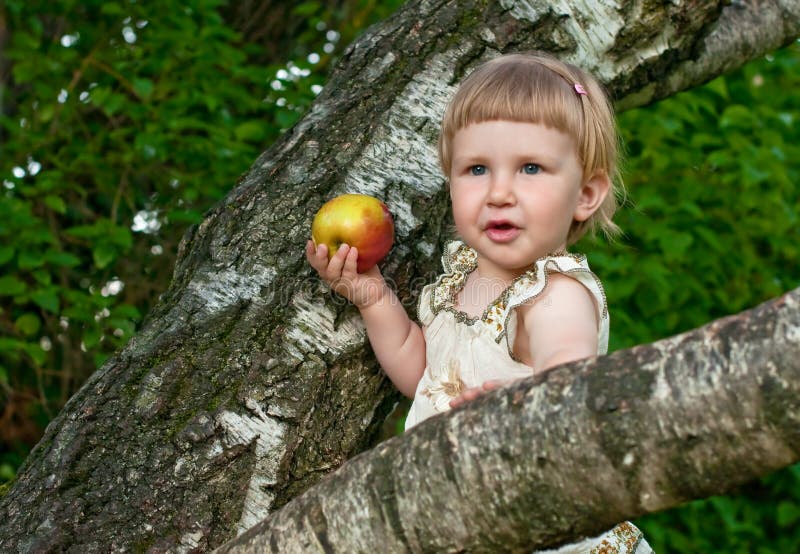 Child eating an apple stock image. Image of season, food - 85350779