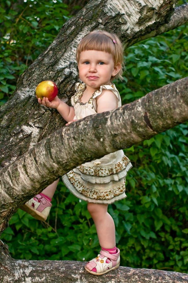 Child Eating Apple in the Tree Branches Stock Photo - Image of girl ...