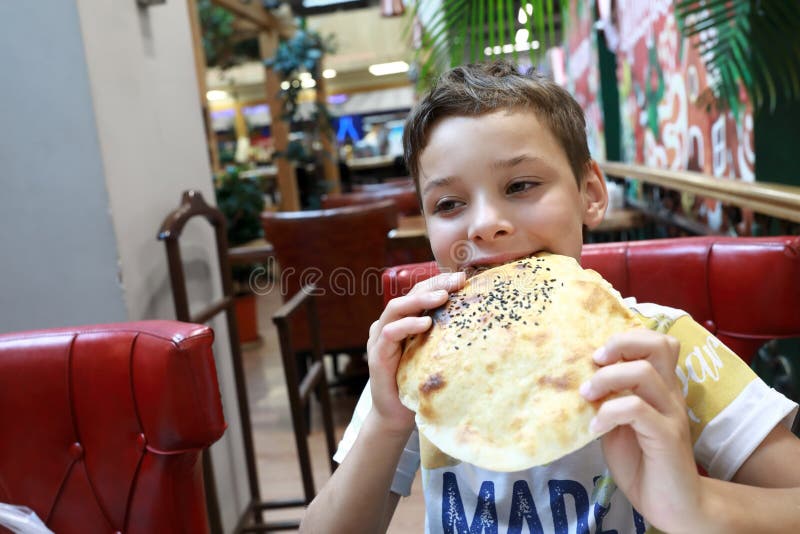 Child eating bread stock image. Image of hungry, gourmet - 189904085