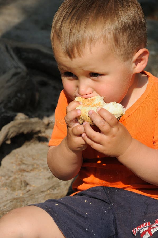 Child eating bread roll stock image. Image of food, twist - 19749161