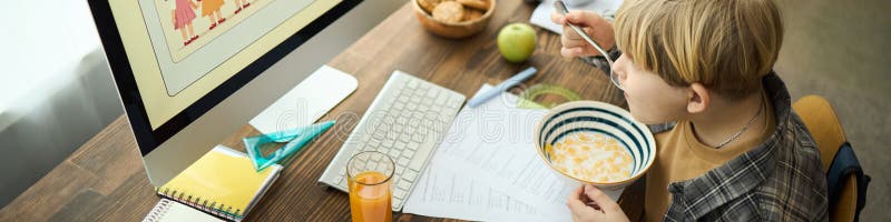 Child Eating Breakfast Studying Computer Stock Photos - Free & Royalty ...