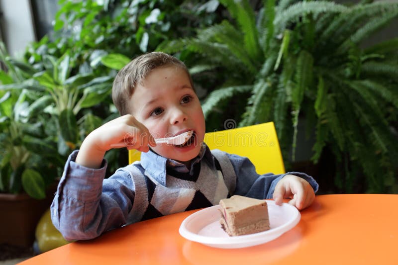 Child eating cake stock image. Image of child, youngster - 1031815