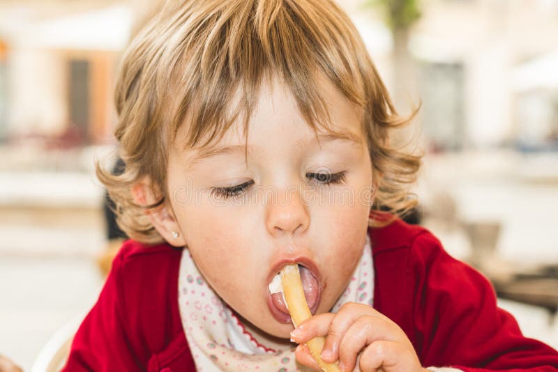 Child eating chips stock image. Image of dinner, product - 117317467