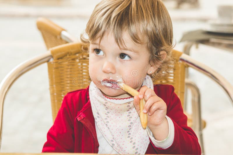 Child eating chips stock image. Image of expression - 117317595