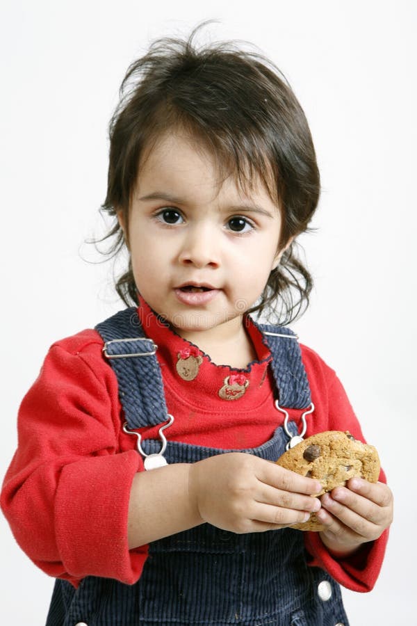 Child eating cookie stock image. Image of girl, elementary - 8272781
