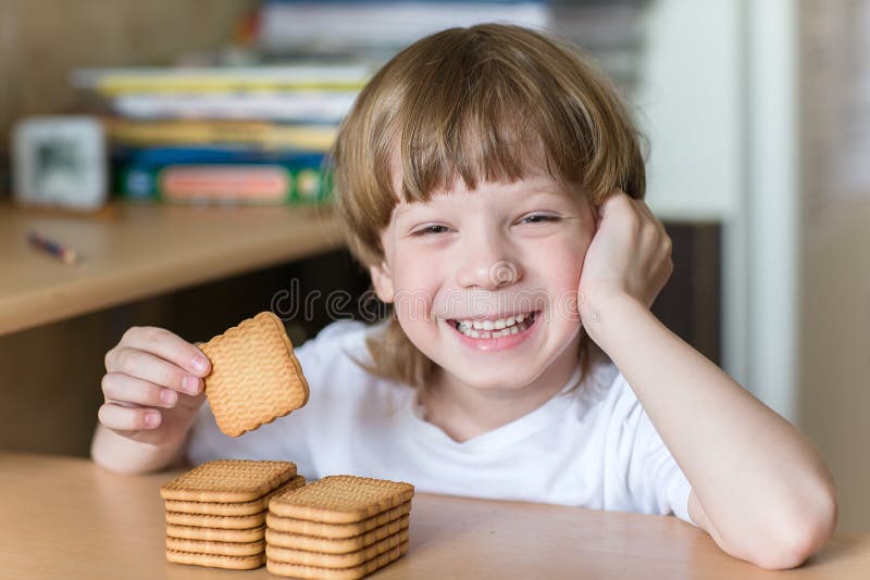 Child eating cookies stock image. Image of portrait, focus - 71485961