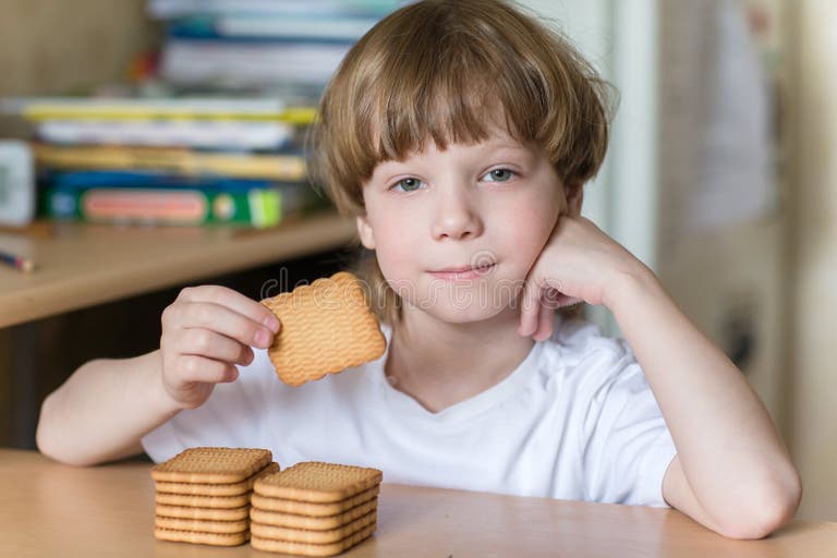 Child eating cookies stock photo. Image of chocolate - 72578852