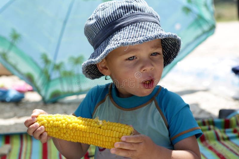 Kid eating corn stock photo. Image of brown, life, caucasian - 50864684