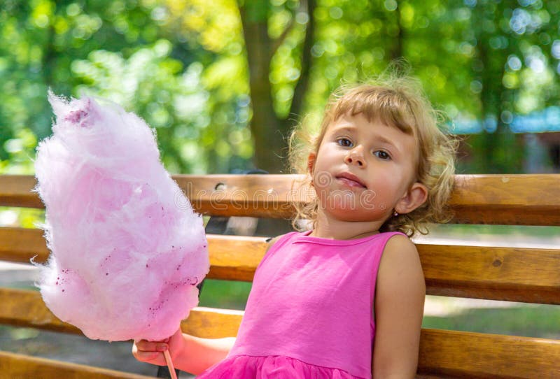Child Eating Cotton Candy in the Park. Selective Focus Stock Image ...