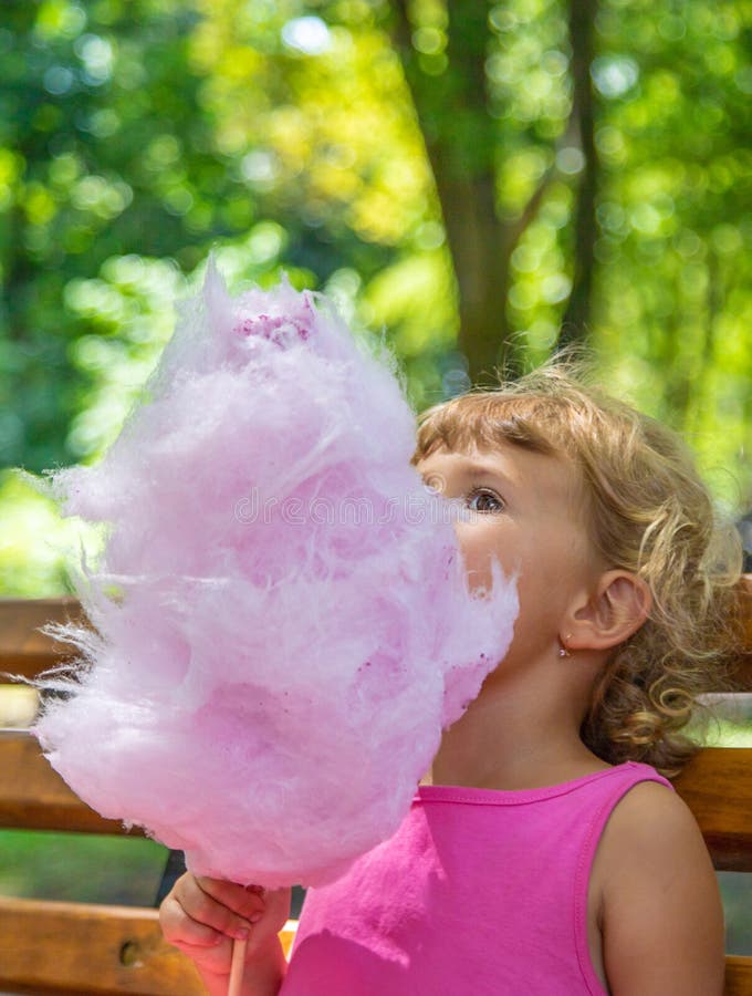 Child Eating Cotton Candy in the Park. Selective Focus Stock Image ...