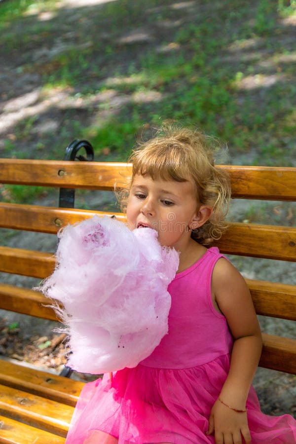 Child Eating Cotton Candy in the Park. Selective Focus Stock Image ...