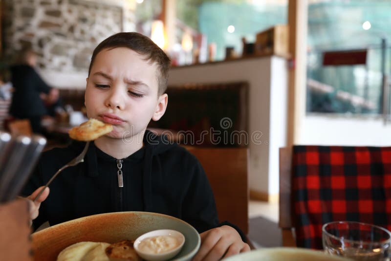 Child eating cutlet stock image. Image of eating, hunger - 215729817