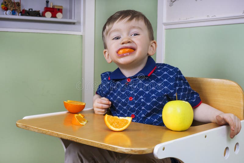 Child eating fruit stock photo. Image of caucasian, funny - 53445252