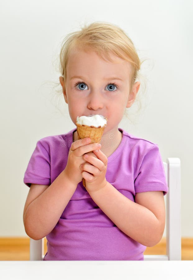 Child eating ice cream stock image. Image of adorable - 26280233