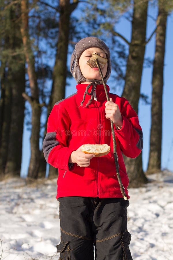 Child Eating Meat on a Picnic in Nature in the Forest Stock Photo ...