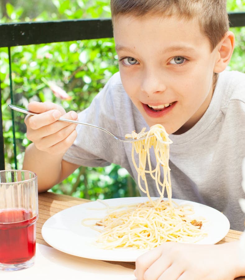 Child Eating Pasta Outdoors Stock Image - Image of eating, healthy ...