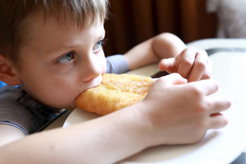Child eating pie stock image. Image of gourmet, brown - 156691007