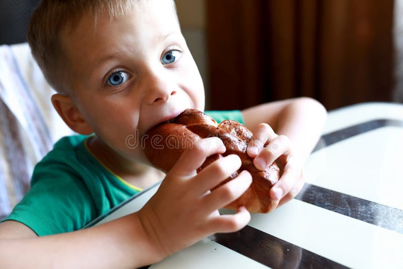 Child eating pie stock photo. Image of indoor, face - 161211300