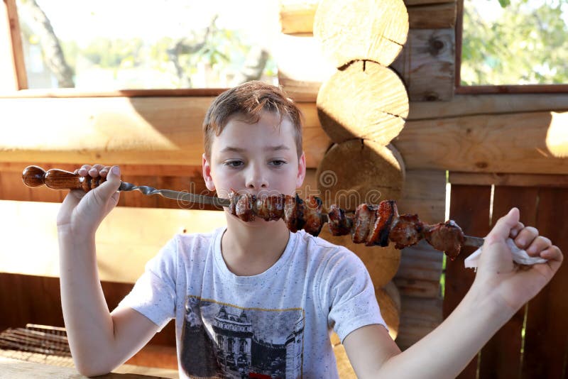 Child Eating Pork Meat on Skewer Stock Image - Image of eating, natural ...