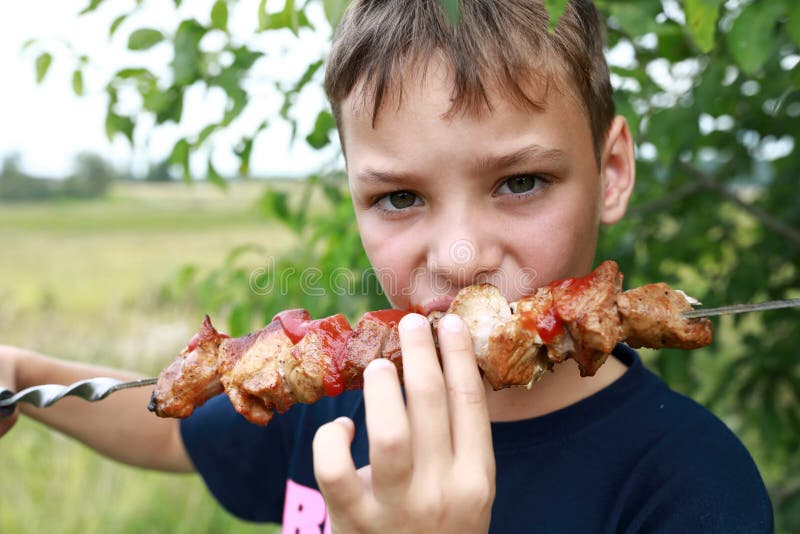 Child Eating Pork Neck Kebab Stock Image - Image of natural, caucasian ...