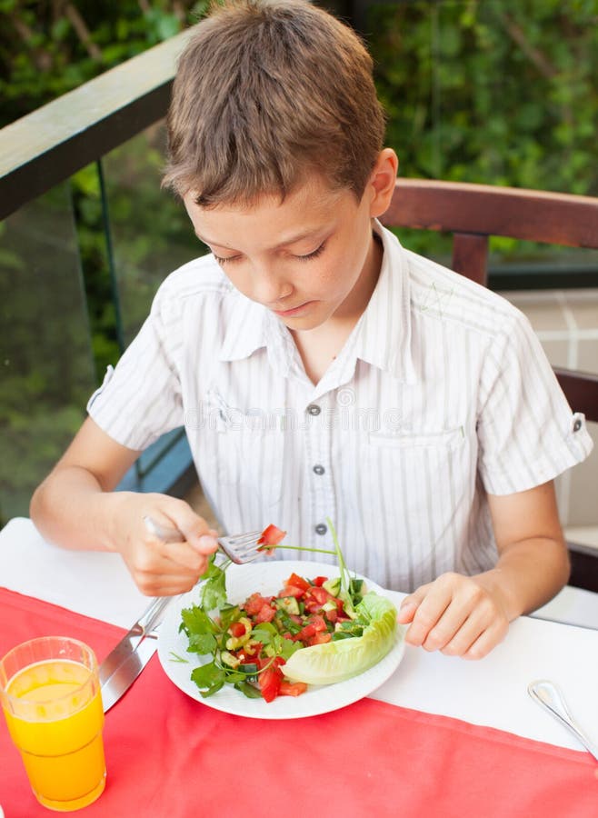 Child Eating Salad at a Cafe Stock Image - Image of hungry, beauty ...