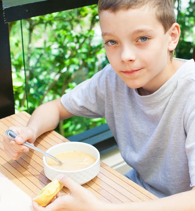 Kid eating soup stock image. Image of people, children - 32675427