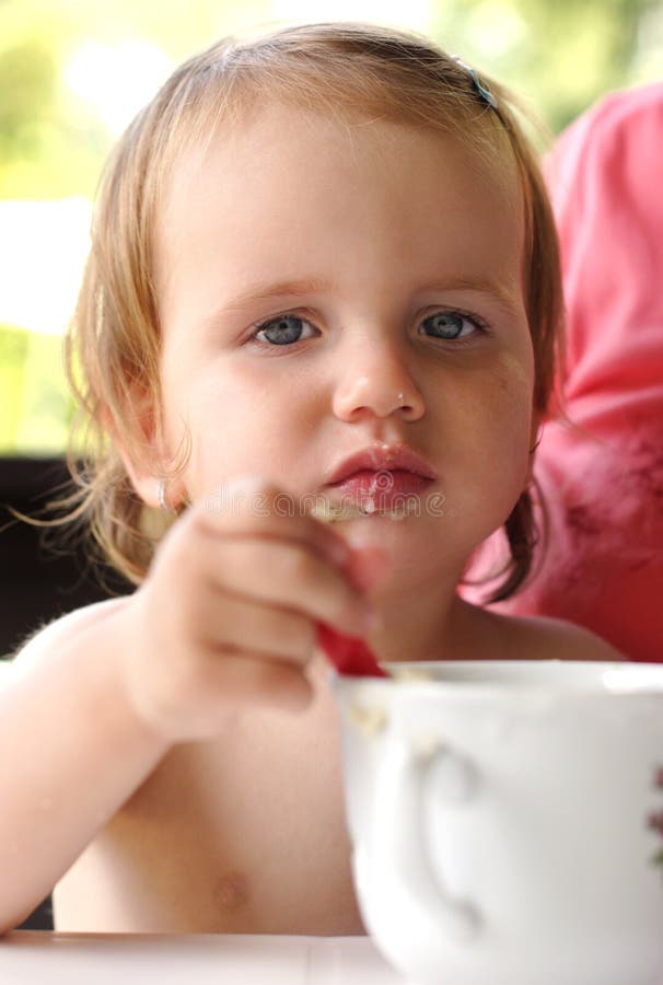 Child eating with spoon stock image. Image of caucasian - 7461439