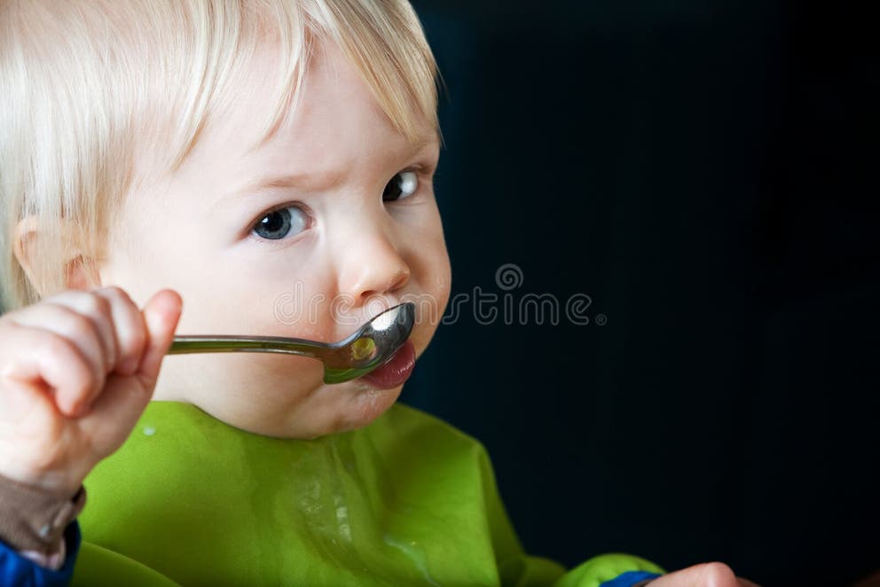 Child Eating with Spoon stock photo. Image of young, caucasian - 7600020