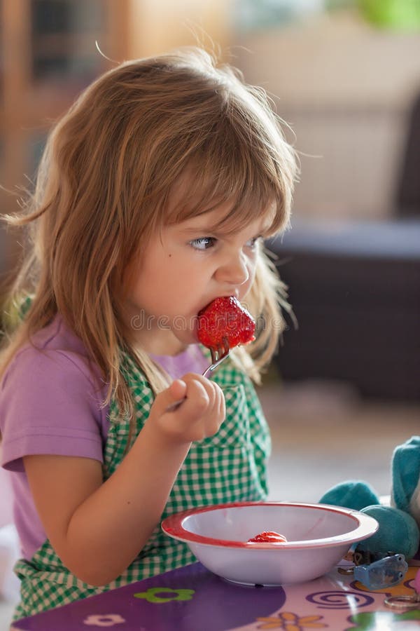 Child eating strawberries stock photo. Image of fruit - 189053596