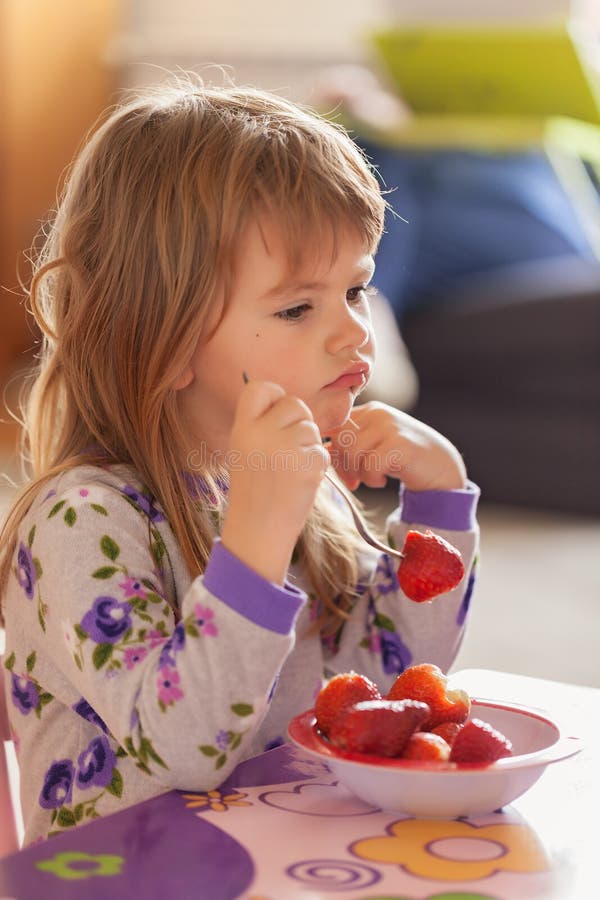 Child eating strawberries stock photo. Image of child - 189053638