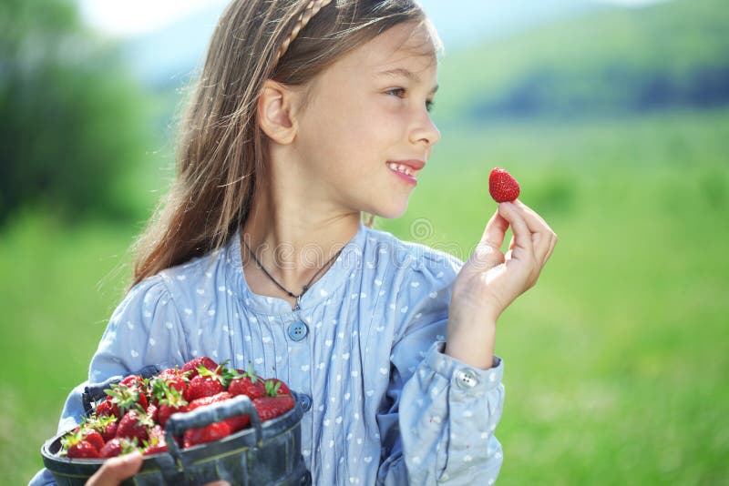 Child Eating Strawberries in a Field Stock Image - Image of beautiful ...