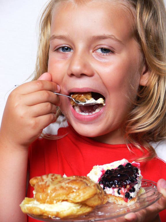 Child is eating sweets stock image. Image of beautiful - 5646039