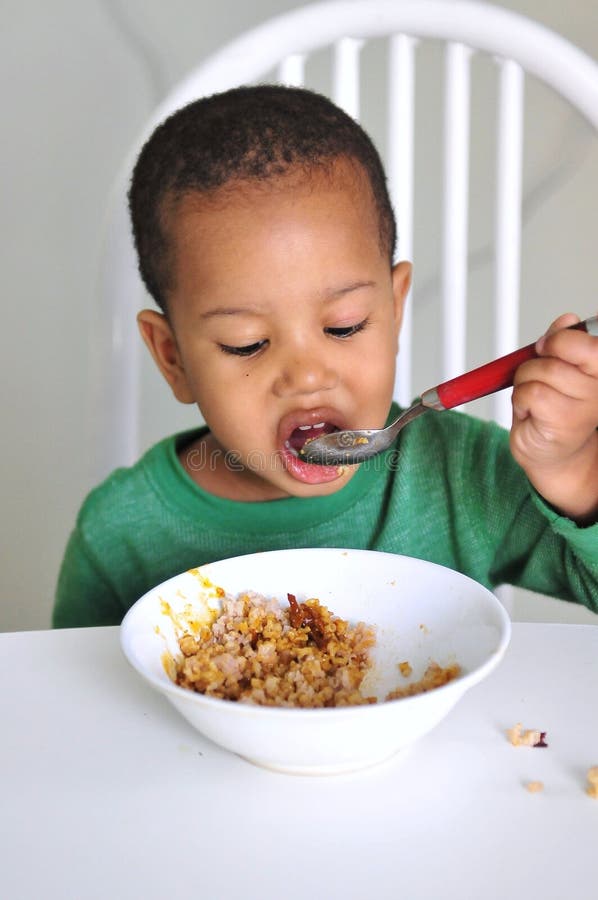 Child Eating At Table Picture. Image: 14776417