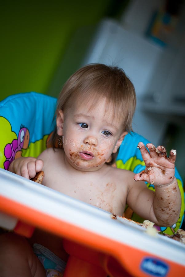 Child Eats Cake in the Highchair Stock Photo - Image of messy, eating ...