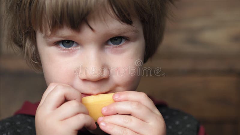 A Child Eats a Piece of Cheese Stock Image - Image of nutrition, person ...