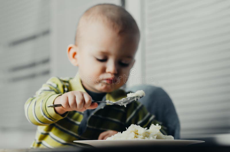 The Child Eats Mashed Potatoes Stock Photo - Image of cutting, fresh ...