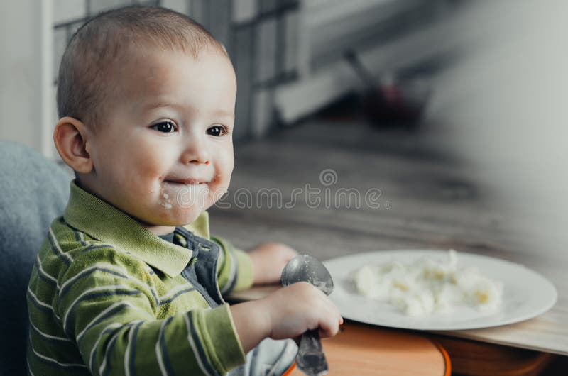 The Child Eats Mashed Potatoes Stock Photo - Image of cutting, face ...