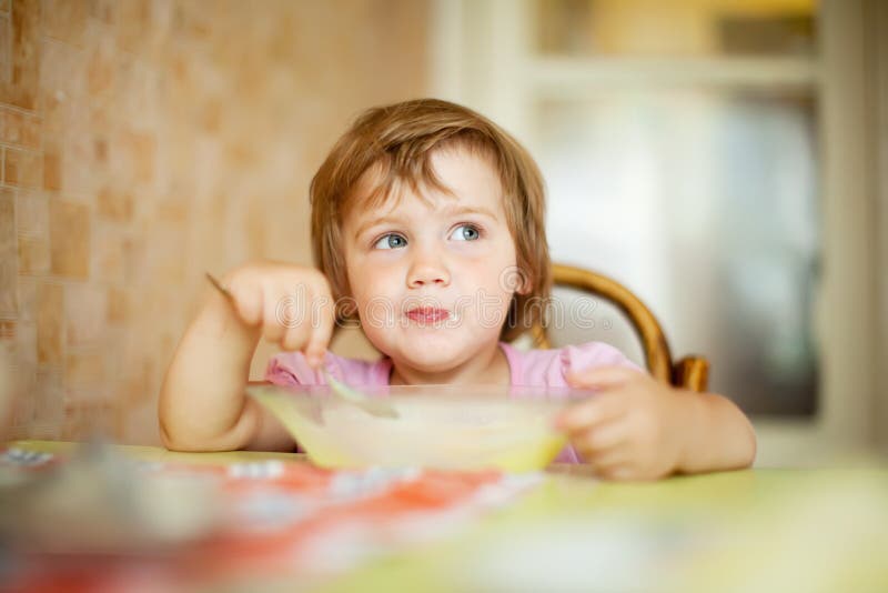 Child Eats from Plate with Spoon Stock Photo - Image of eating, small ...