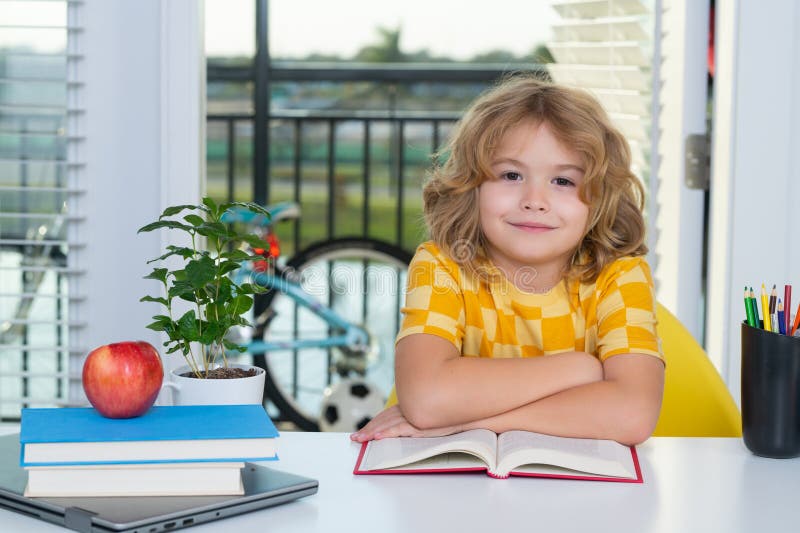 Child from Elementary School with Book Doing Homework at Home. Child ...
