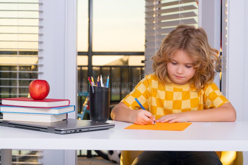 Child from Elementary School Writing School Homework at Home. Little ...